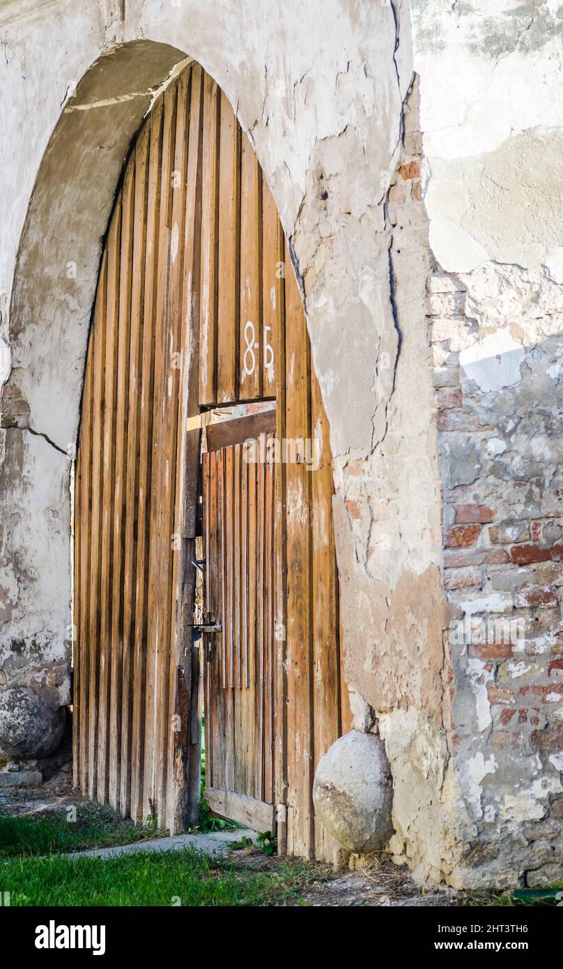 Old dilapidated house in the suburbs of Petrovaradin Fortress. Gate on ...