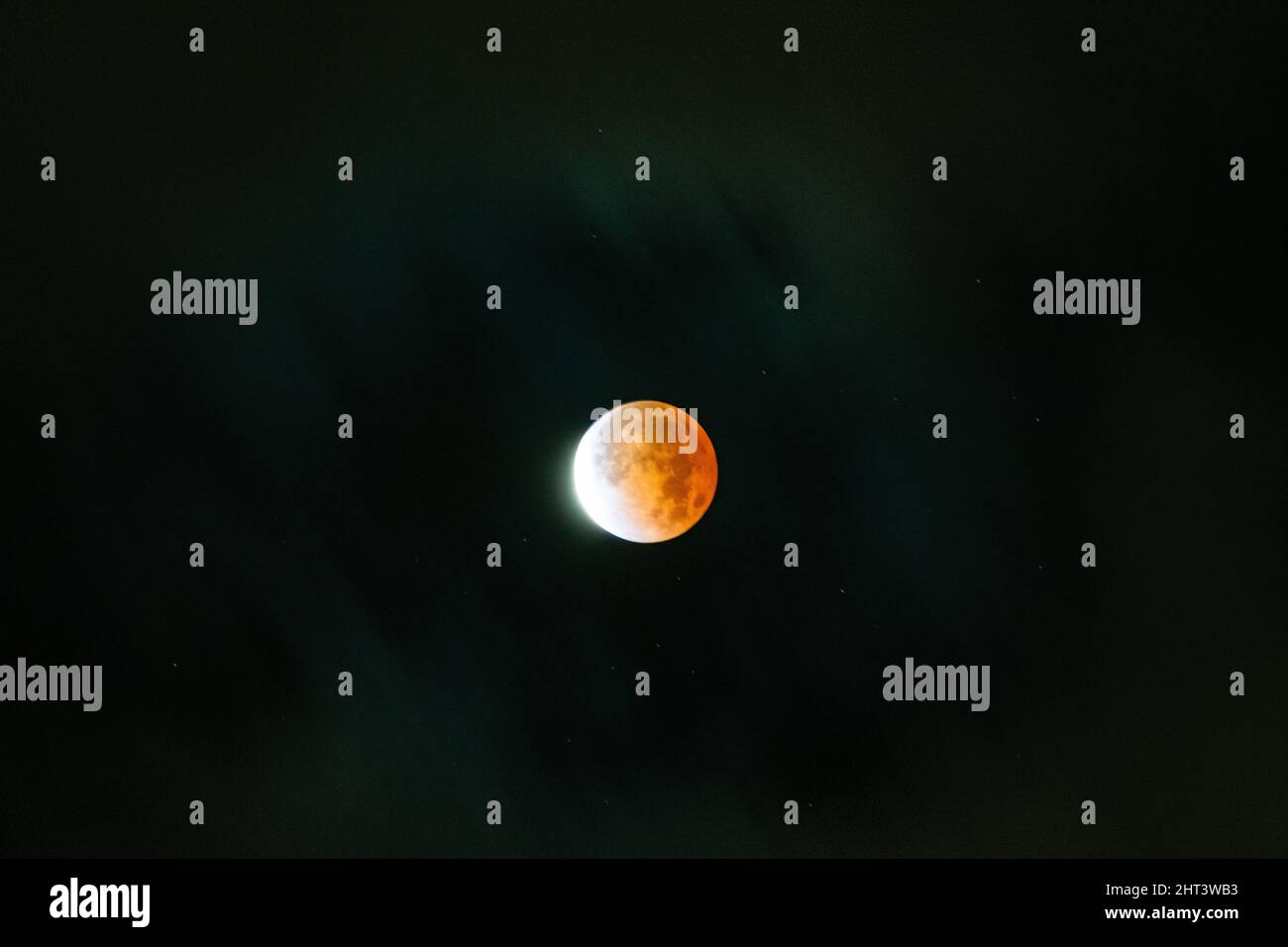 Beautiful lunar eclipse in a dark sky Stock Photo - Alamy