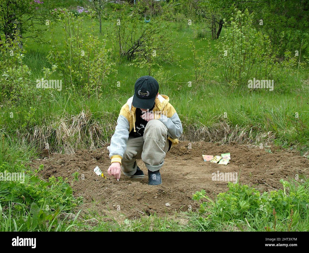 Child planting seed hi-res stock photography and images - Alamy