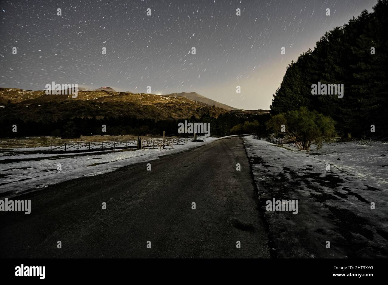 mountain nightscape star trails frozen road Stock Photo - Alamy