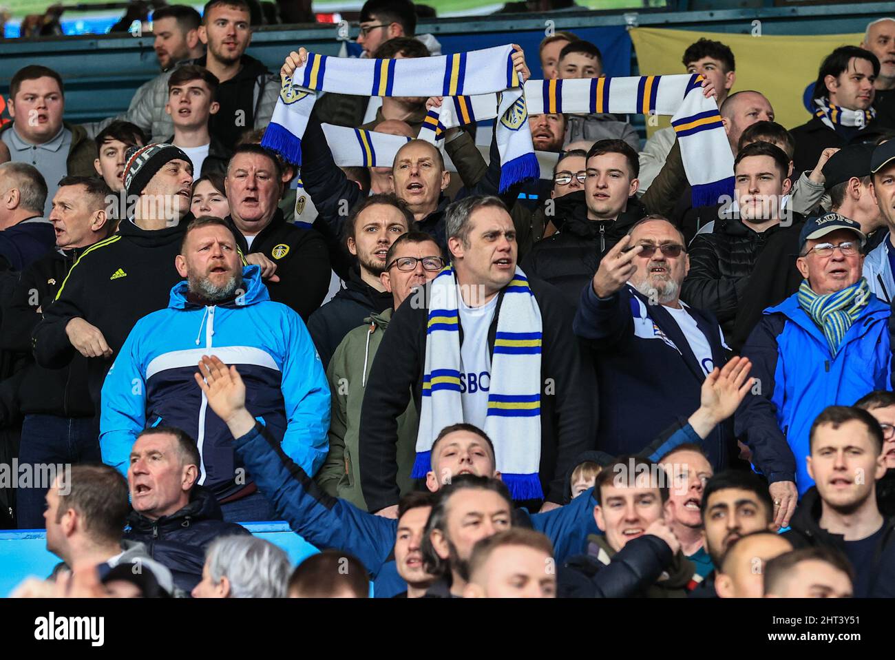 Leeds fans sing and wave scarfs Stock Photo - Alamy