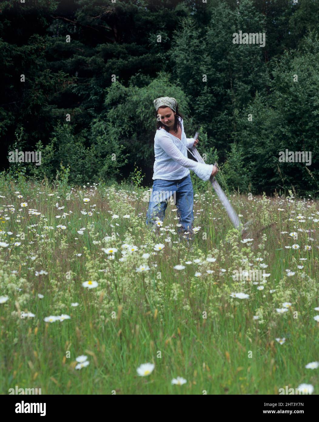 Woman with scythe Stock Photo - Alamy