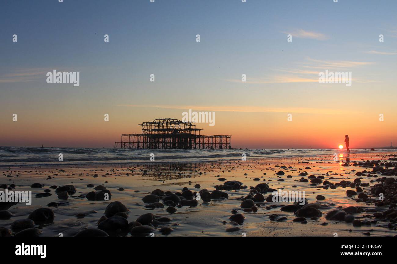 Beautiful shot of the Brighton West Pier at sunset in Brighton, UK ...