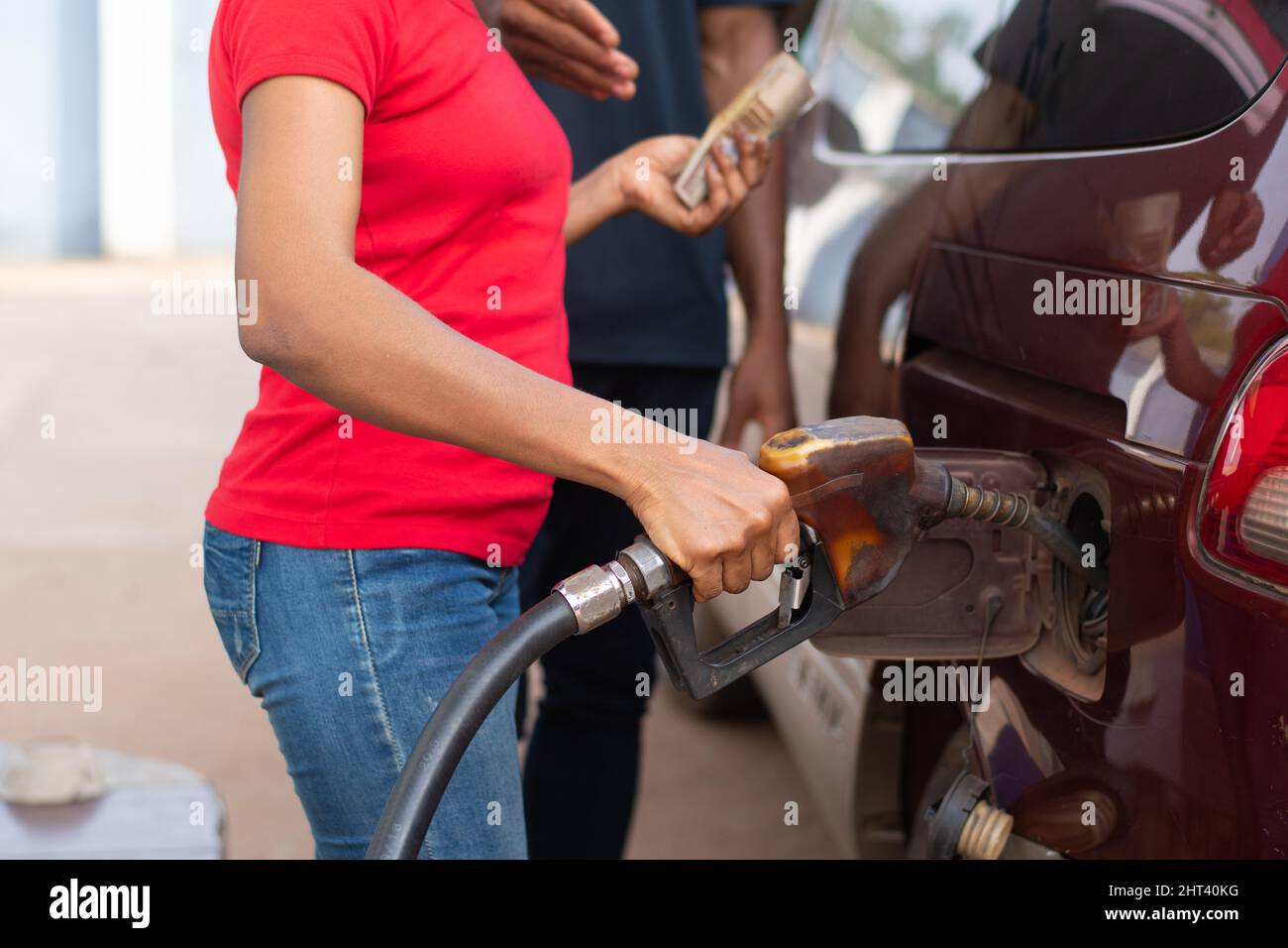 Nigerian man selling petrol hi-res stock photography and images - Alamy