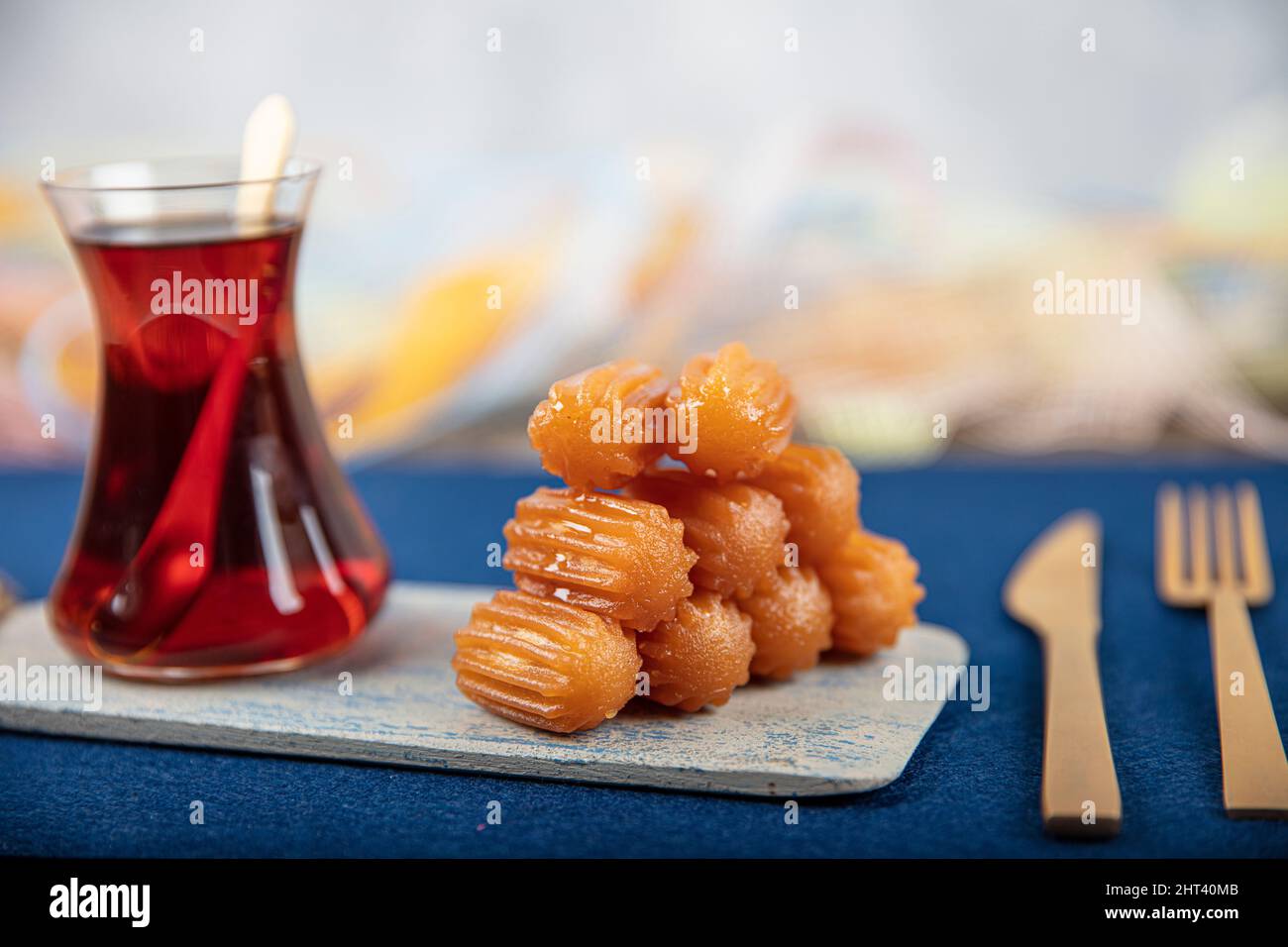 Traditional Turkish dessert tulumba, tulumba tatlisi in a plate served ...
