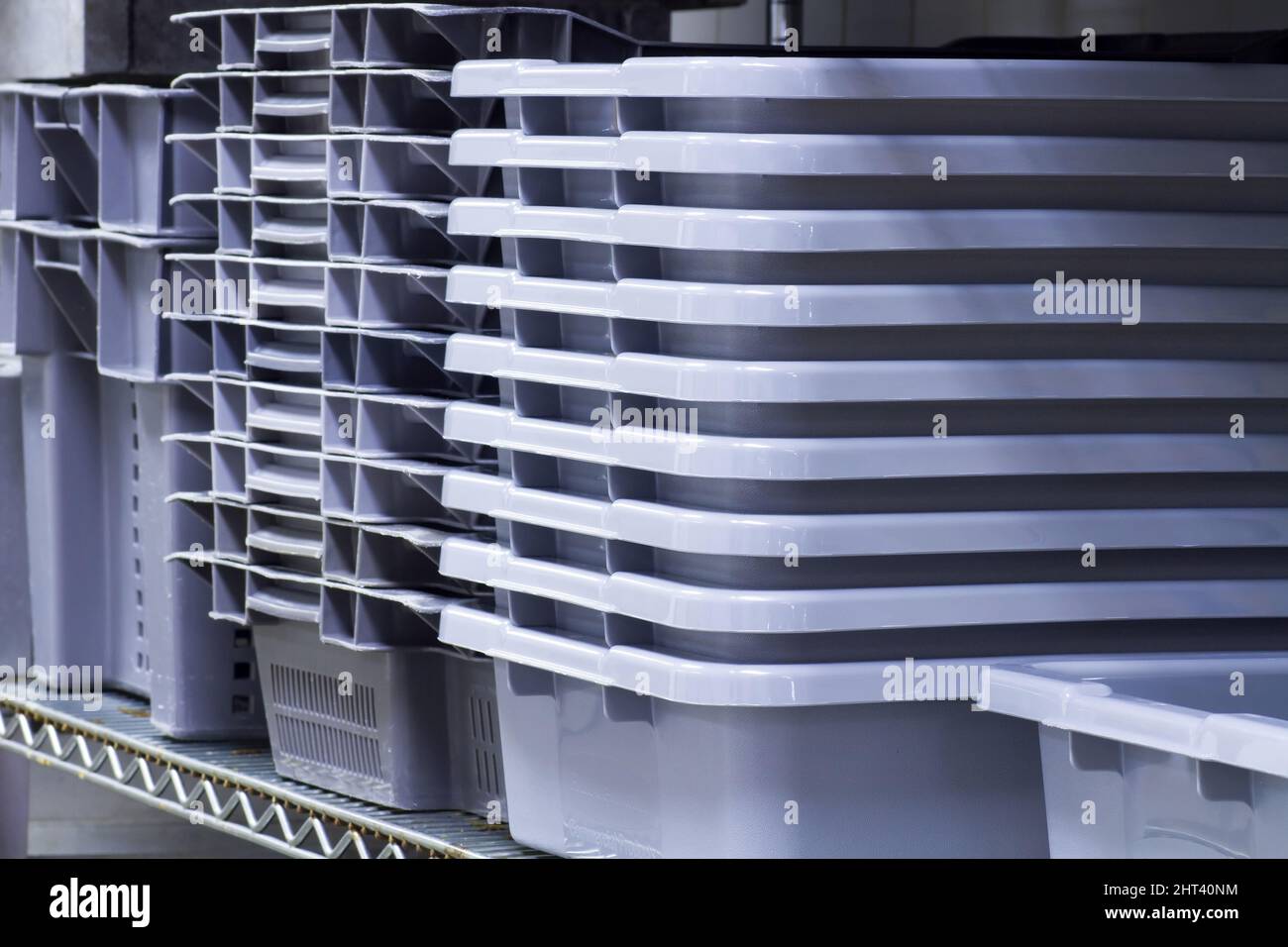 Stack of food grade plastic pans Stock Photo - Alamy