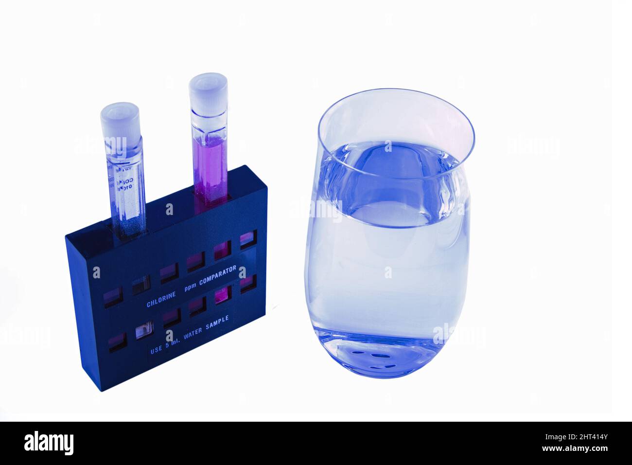 Glass of water next to chlorine test colorimeter Stock Photo - Alamy
