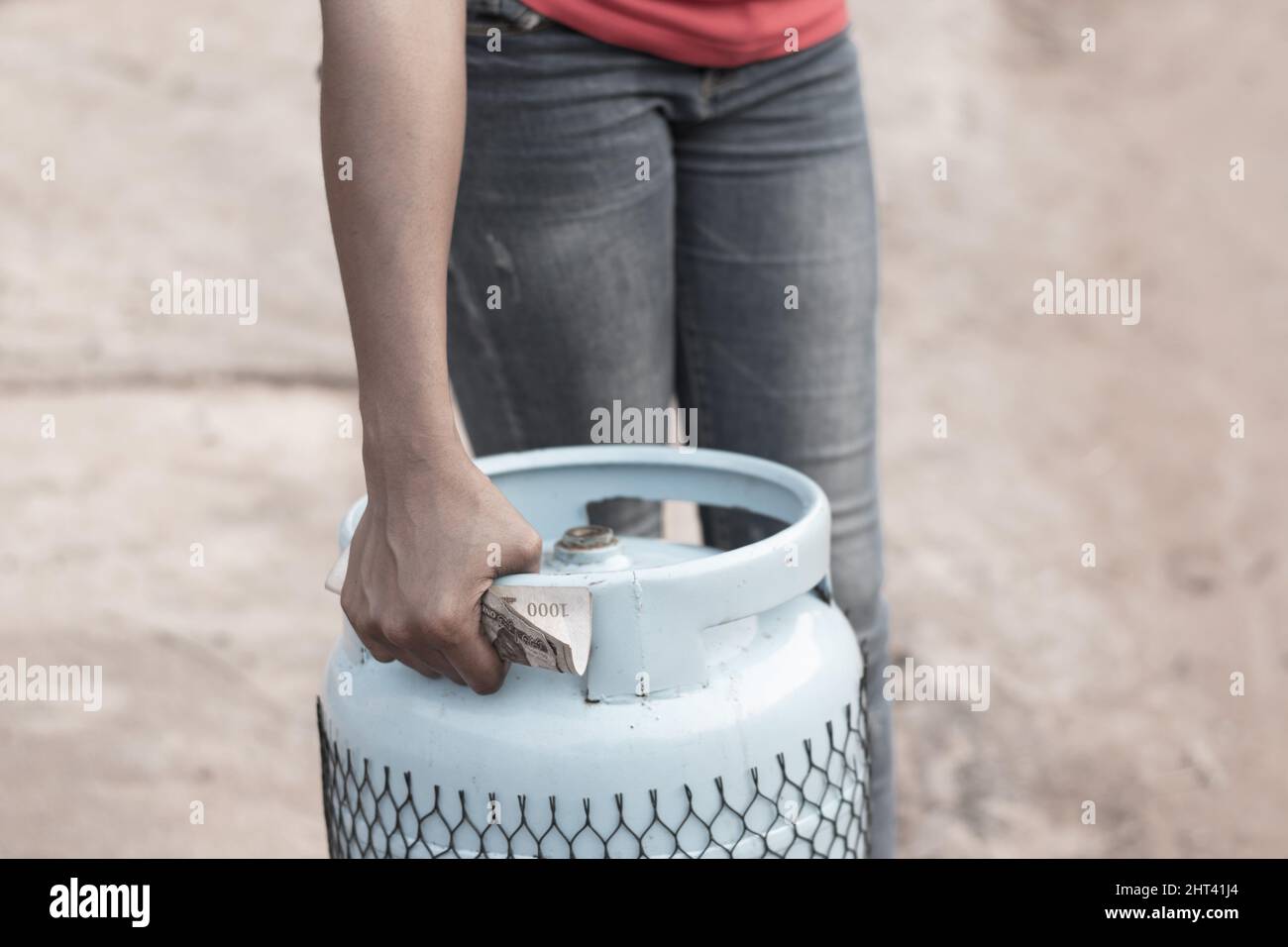 Carrying a gas cylinder hi-res stock photography and images - Alamy