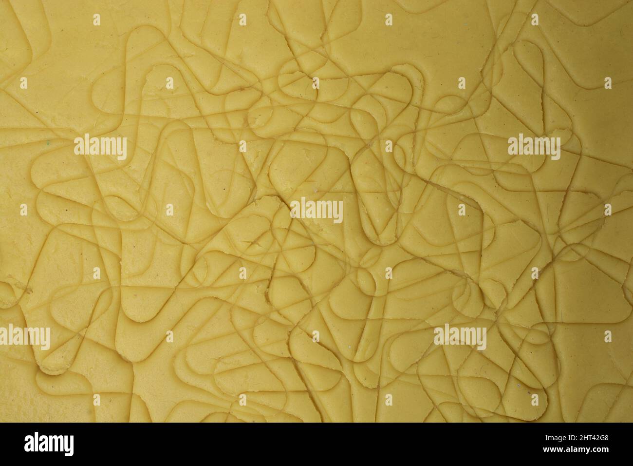 Closeup of a cookie dough with abstract shape pattern Stock Photo - Alamy