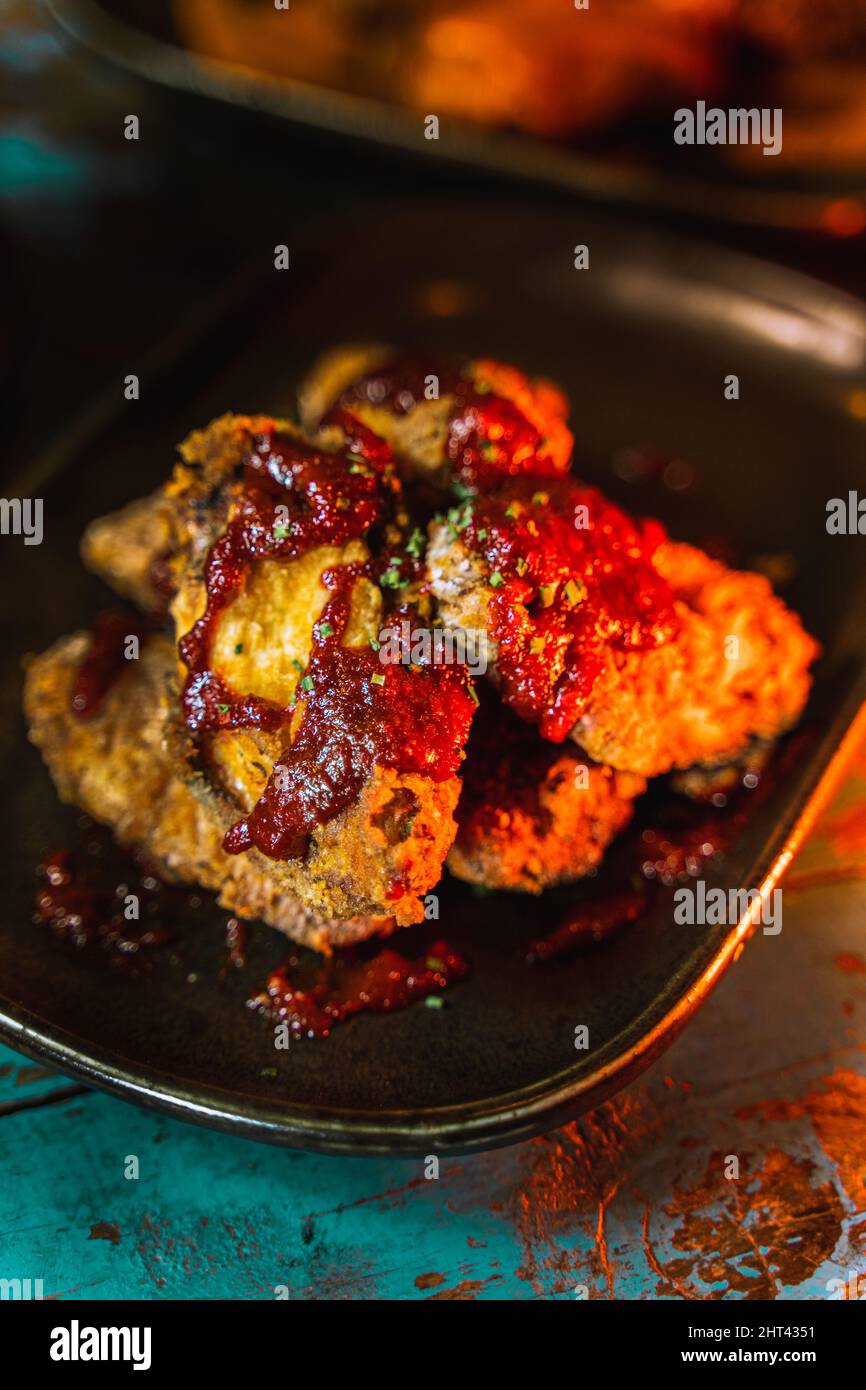 Tasty chicken wings dish in a dark grungy restaurant setting Stock ...