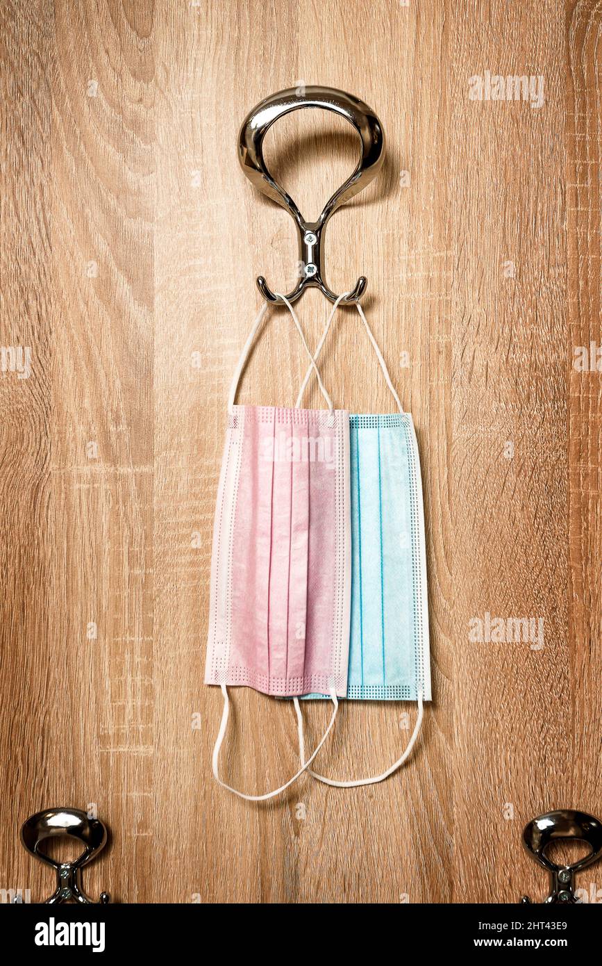 Protective surgical face masks on anteroom coat hanger stand during ...