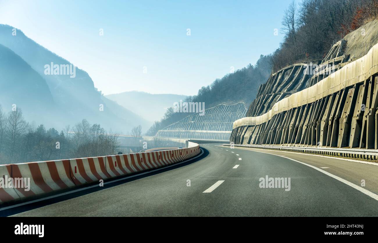 Highway with road slope erosion protection on the hillside Stock Photo ...