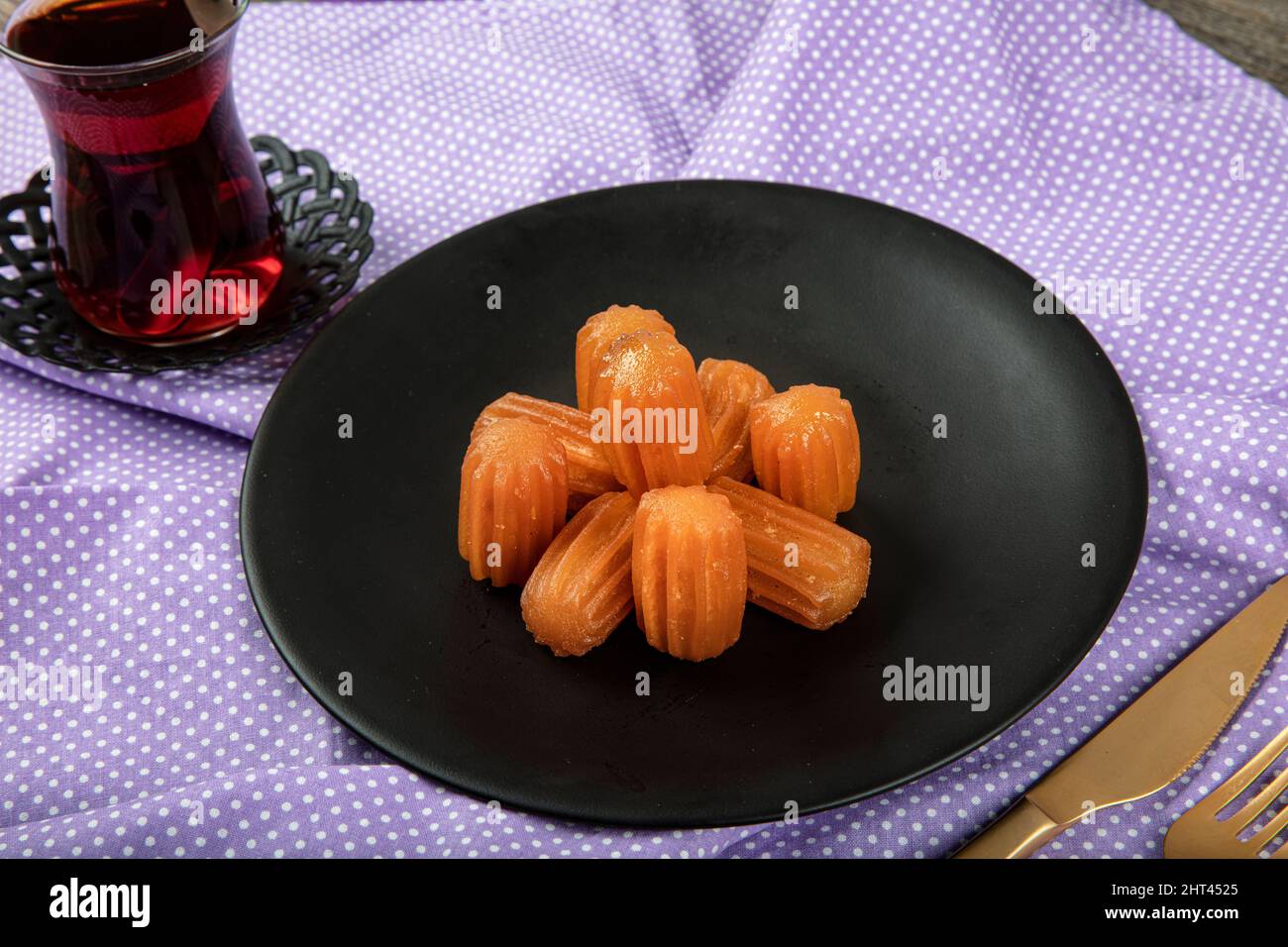 Traditional Turkish dessert tulumba, tulumba tatlisi in a plate served ...