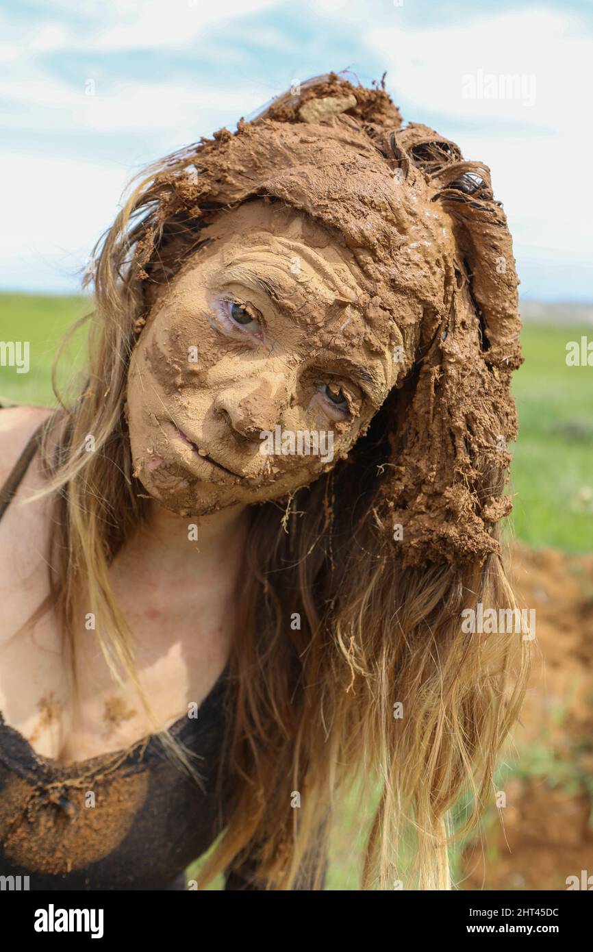 A woman buried in the ground A face covered in the ground Stock Photo ...