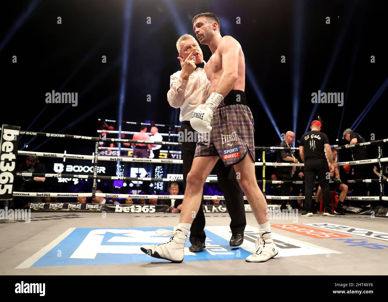 Referee Marcus Macdonald (left) takes a point off Josh Taylor against ...