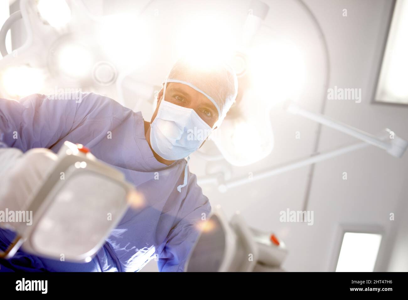 A light at the end of the tunnel. Patients view of a doctor trying to ...