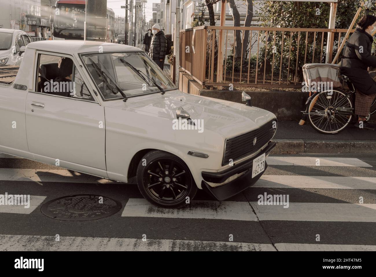 Old white car driving on a road in Kodaira, Japan Stock Photo - Alamy