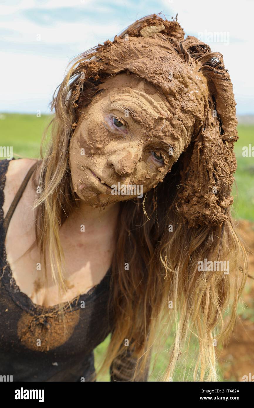 A woman buried in the ground A face covered in the ground Stock Photo ...