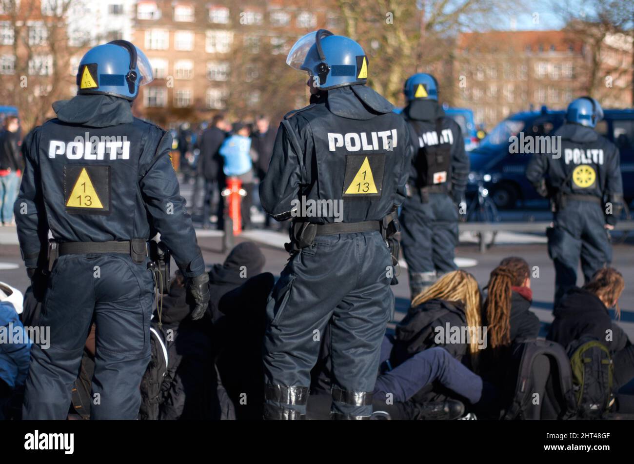 Ready for anything. Rearview shot of a police man in riot gear Stock ...