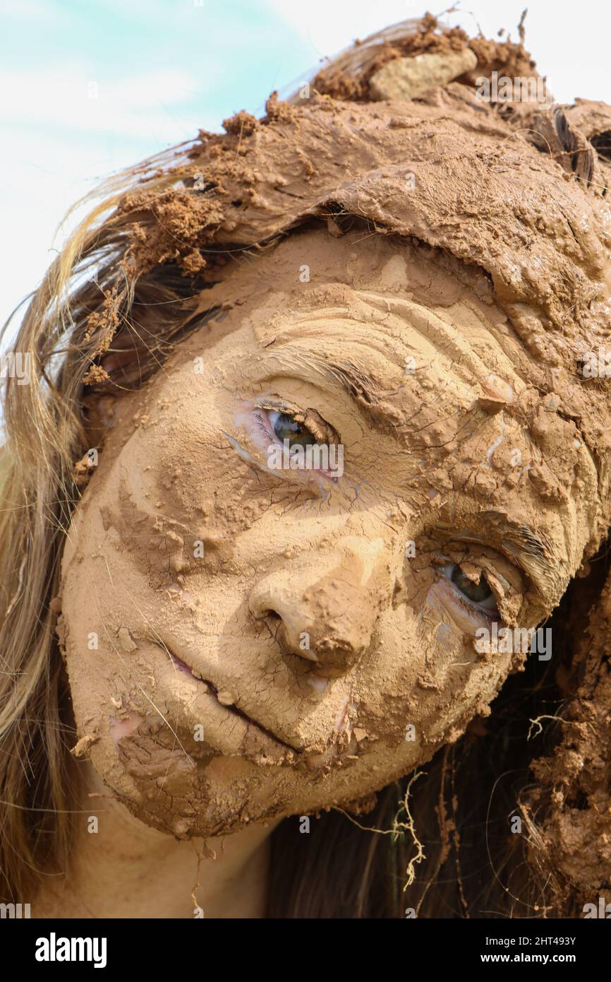 A woman buried in the ground A face covered in the ground Stock Photo ...