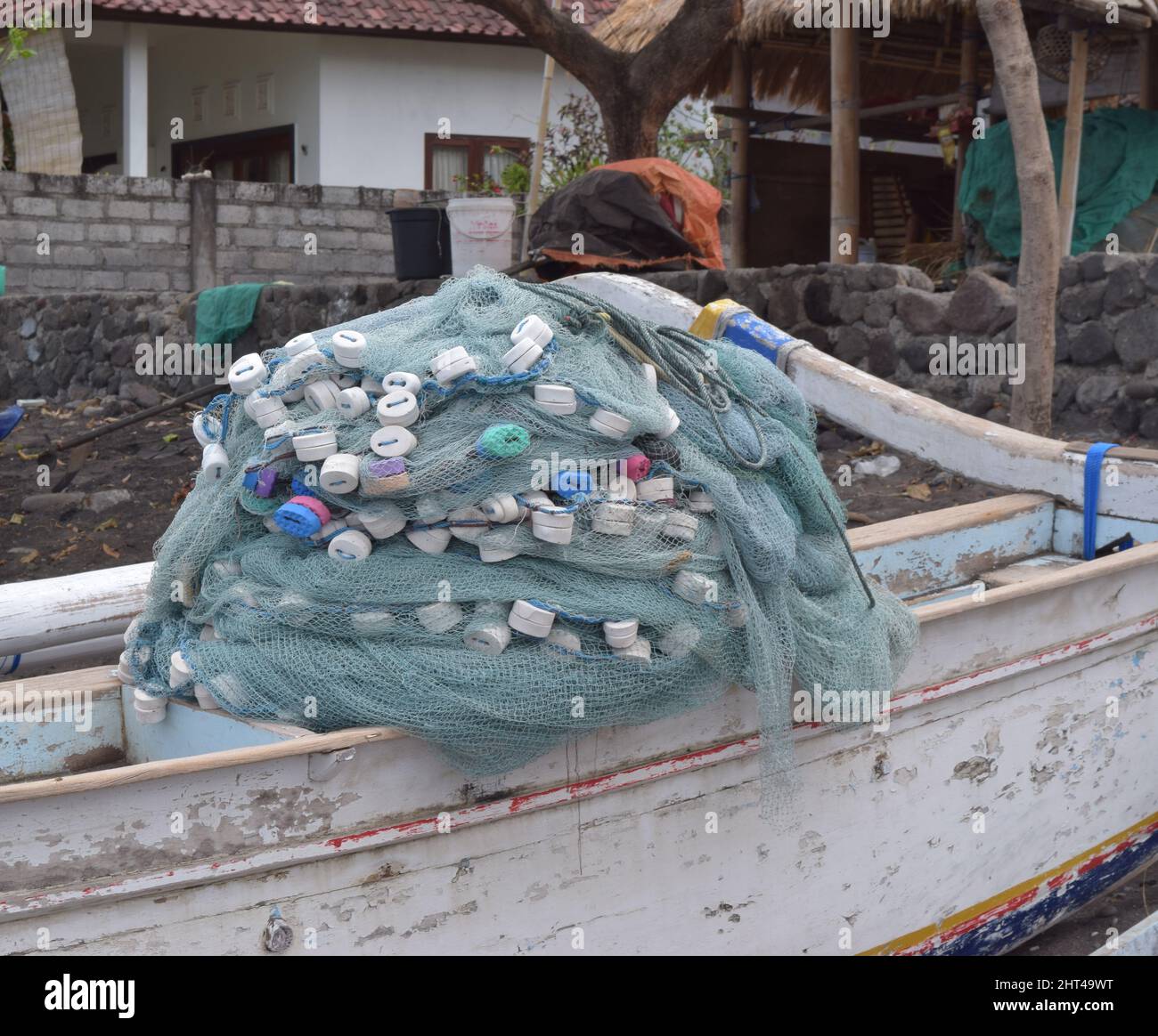Fishing boats and nets on Bali beach Stock Photo - Alamy