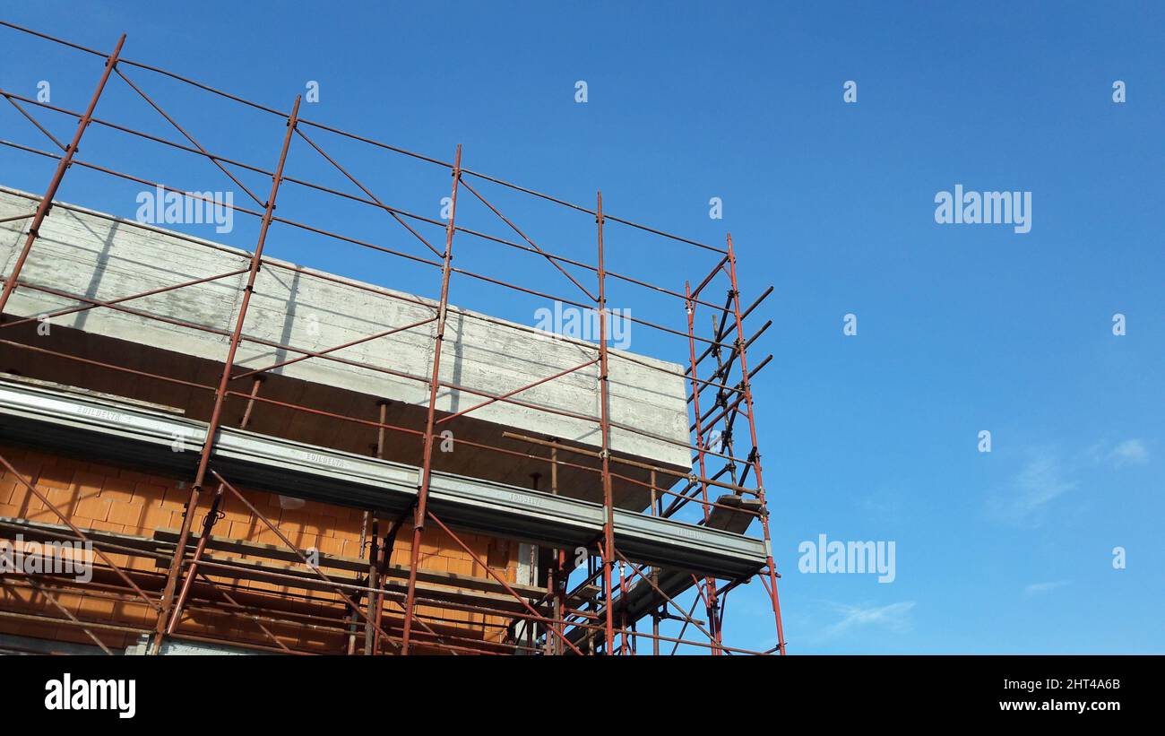 Low angle view of scaffold on the building Stock Photo - Alamy