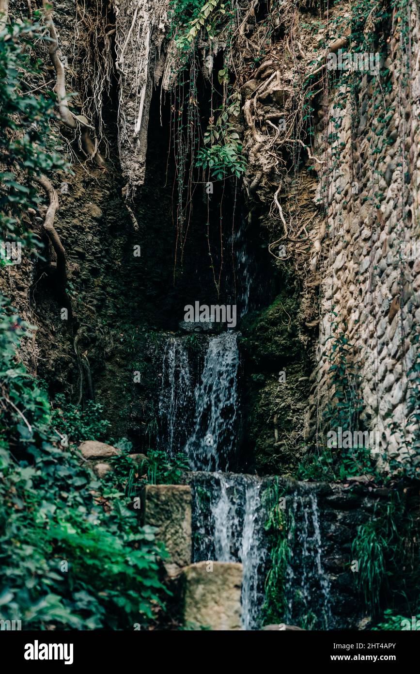 Beautiful waterfall near an ancient building Stock Photo - Alamy