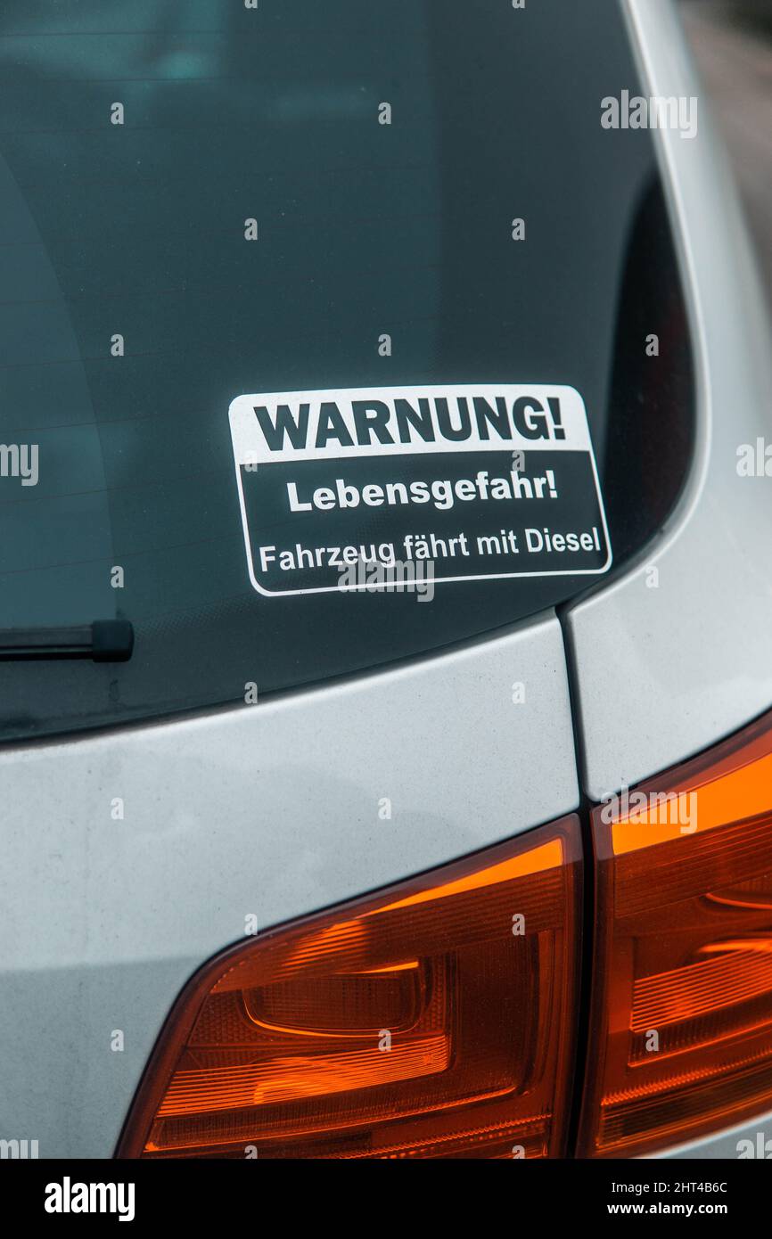 Vertical shot of a warning sign on a car window Stock Photo - Alamy