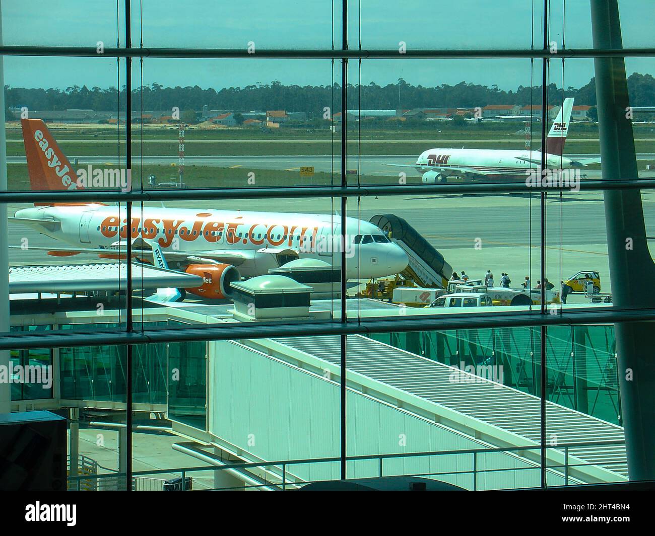 Easyjet airlines company. Airplanes on airports, passengers entering on ...