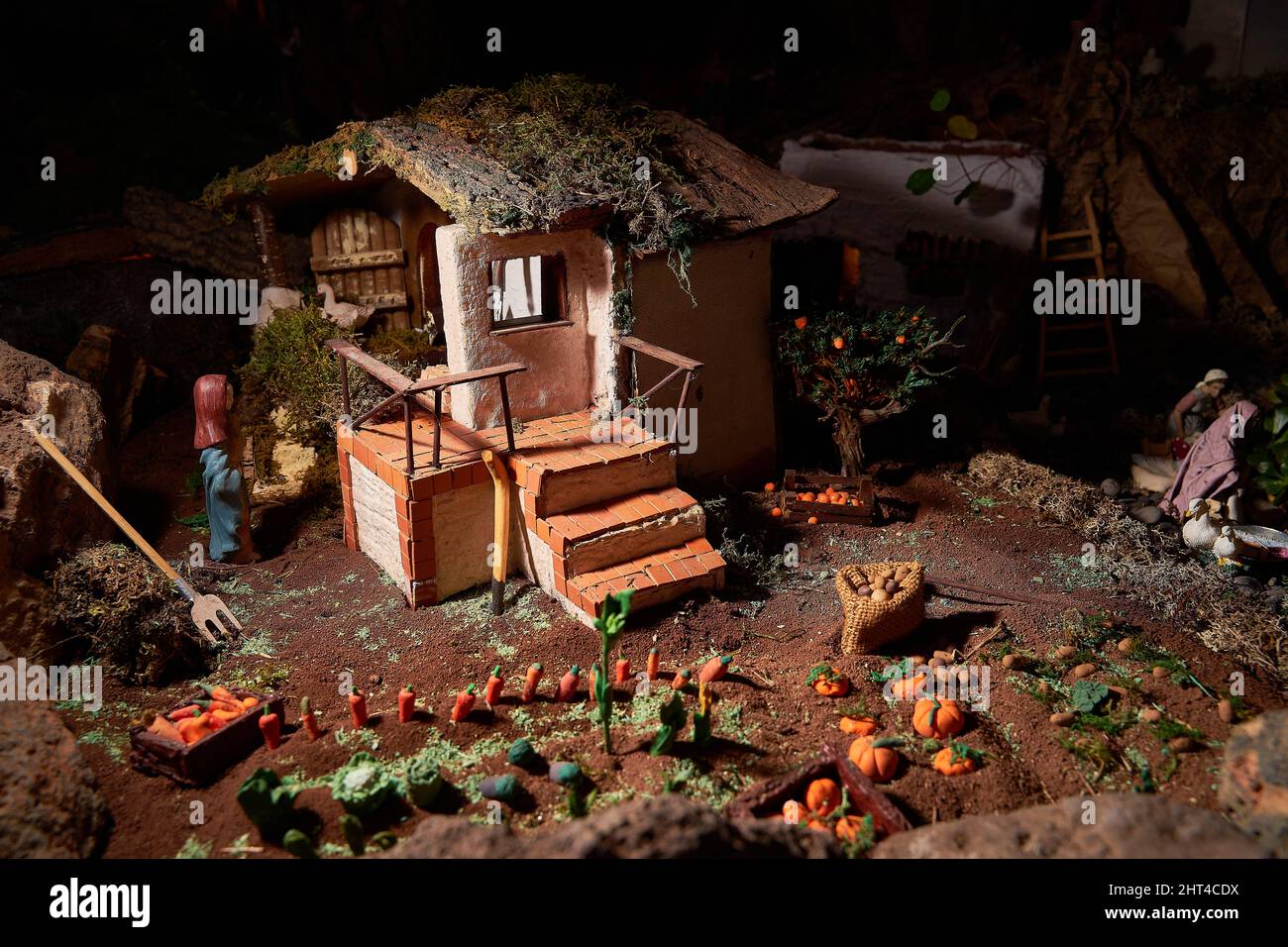 Domestic activity scene with small miniature realistic figures Stock ...