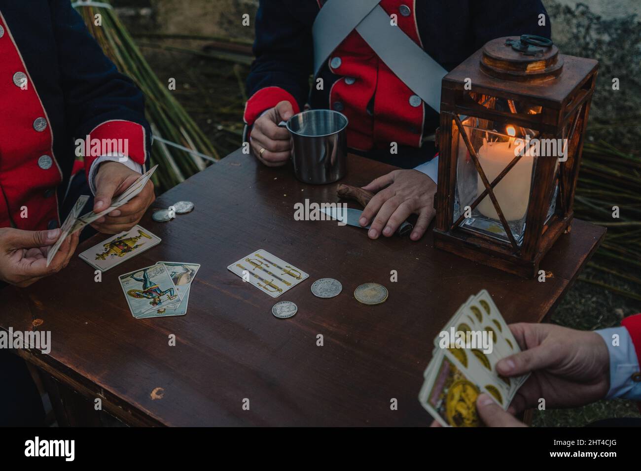Photo of soldiers sitting around a wooden table and playing cards Stock ...