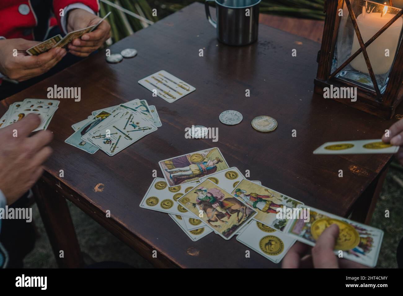 Photo of soldiers sitting around a wooden table and playing cards Stock ...