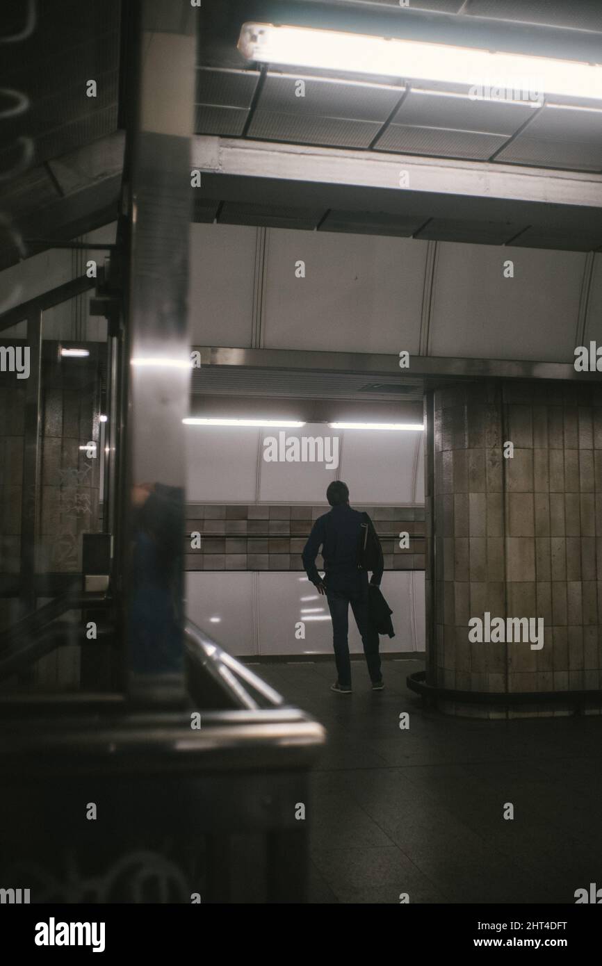 Vertical shot of a man waiting for a train in a railway station Stock ...