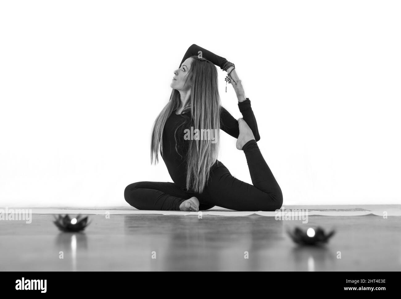 Young woman doing pilates and yoga positions Stock Photo - Alamy