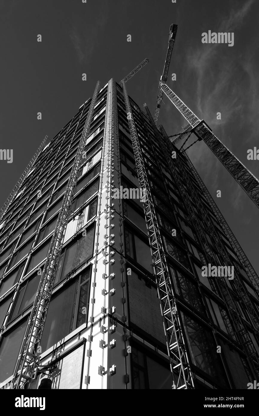 Grayscale of a building under construction on a clear sky Stock Photo ...