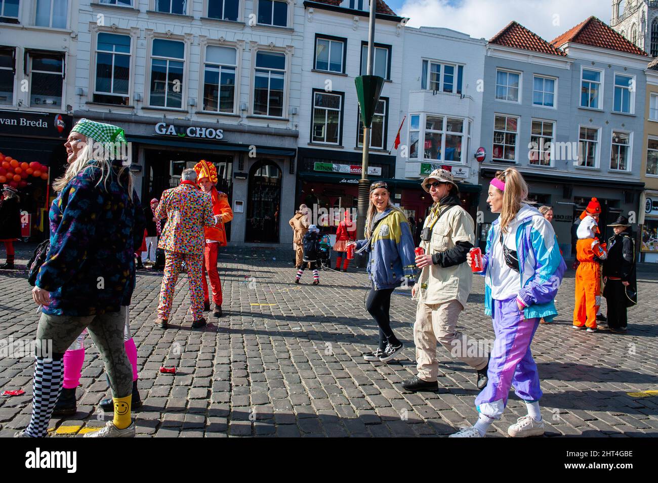 Dutch people are seen wearing different costumes on the streets ...
