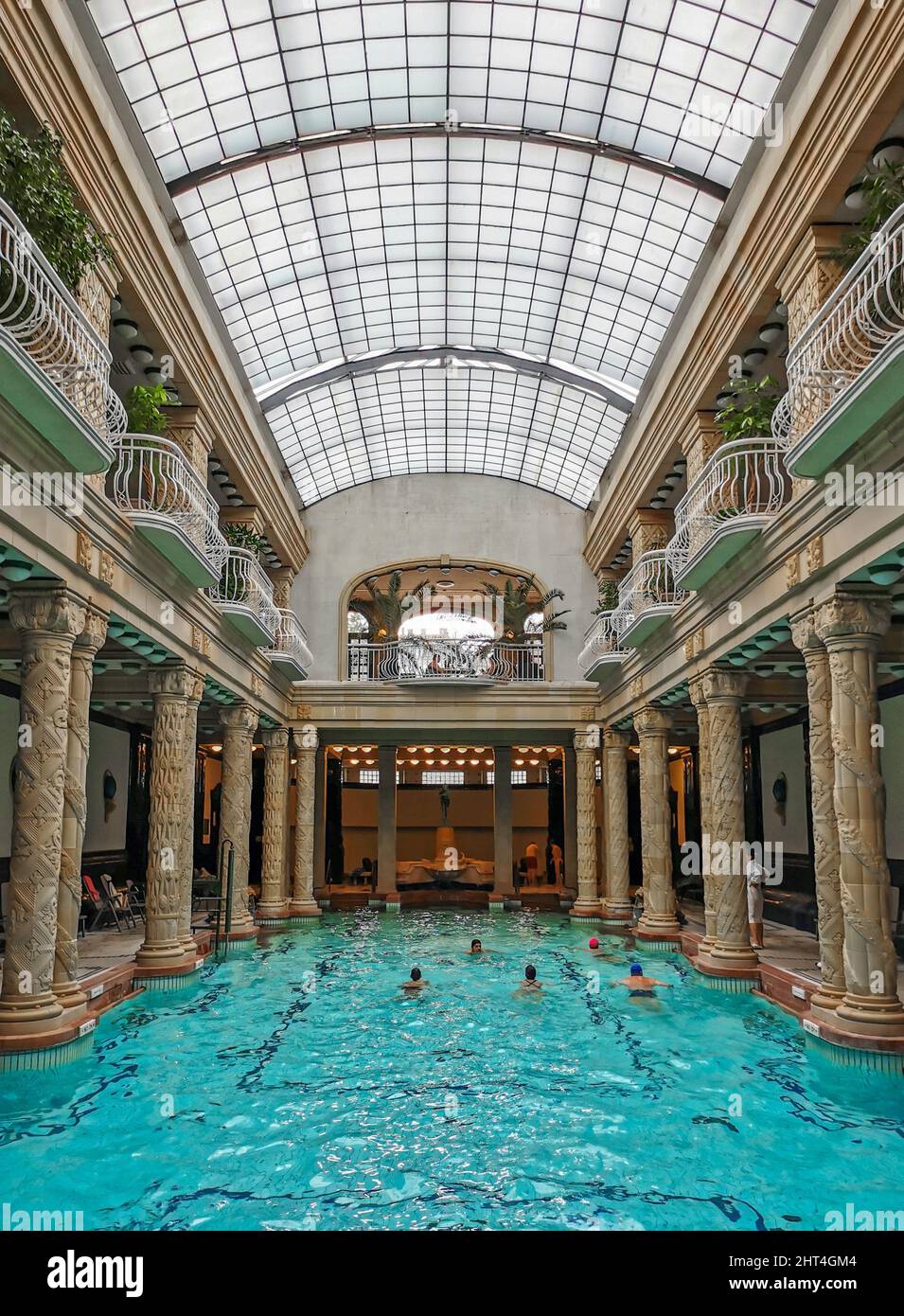 Group of people swimming in an indoor pool at Gellert spa in Budapest ...