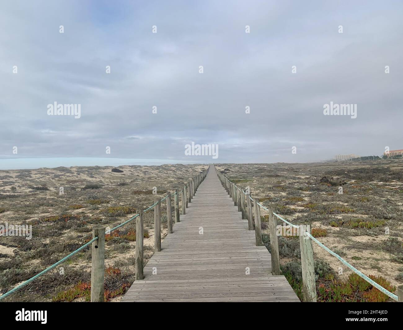 A view of the wooden walk path on a cloudy day Stock Photo - Alamy