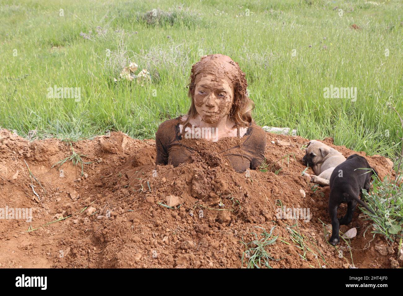 A woman buried in the ground A face covered in the ground Stock Photo ...