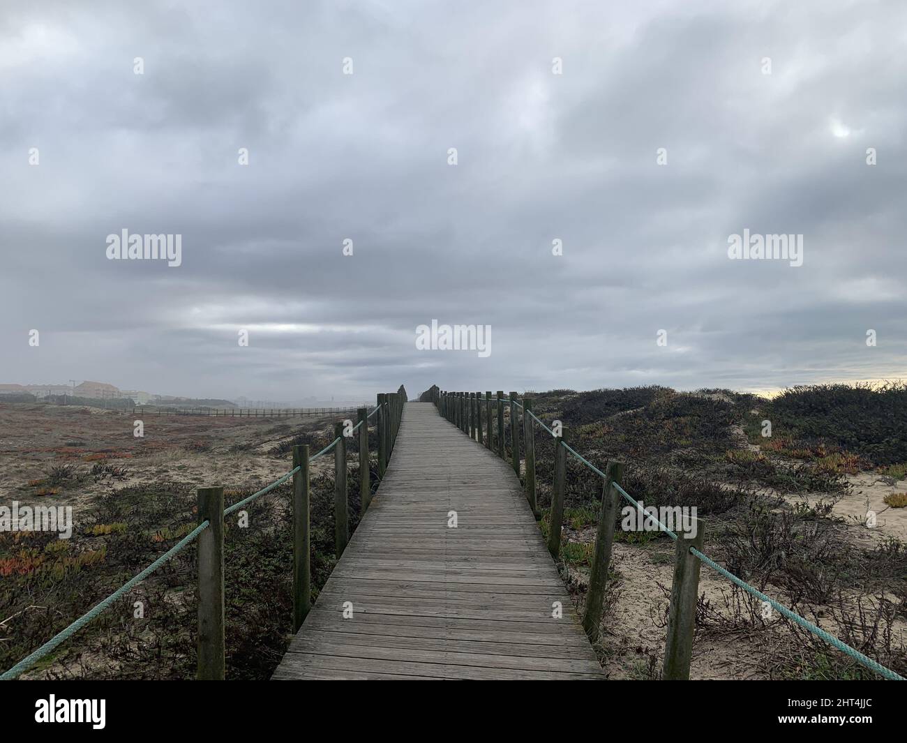 Closeup of a wooden bridge on a field Stock Photo - Alamy