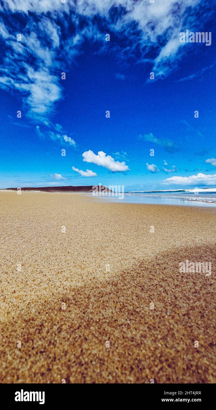 Beautiful vertical photo of a beach with blue sky and clouds Stock ...