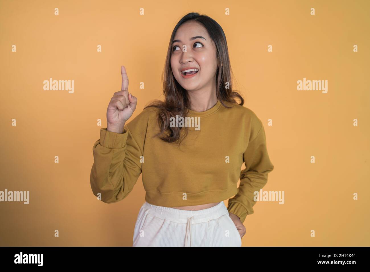 young woman with finger pointing hand gesture Stock Photo - Alamy