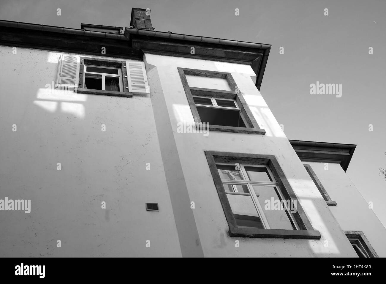 Grayscale of an old residential building with restored facade in ...