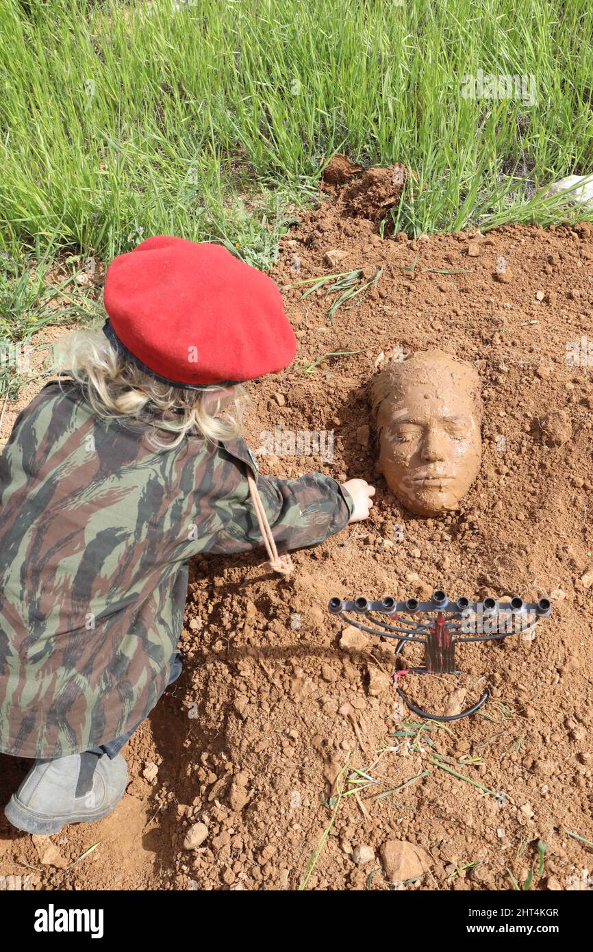 A woman buried in the ground A face covered in the ground Stock Photo ...