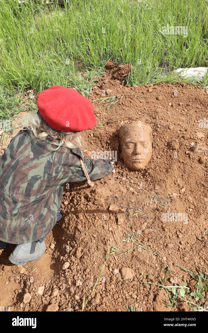 A woman buried in the ground A face covered in the ground Stock Photo ...