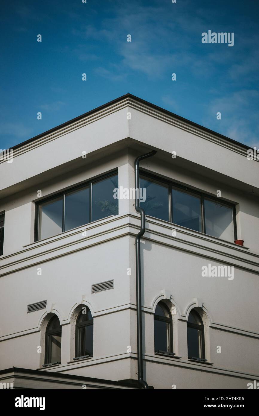Closeup of a white modern building with a clear sky background Stock ...