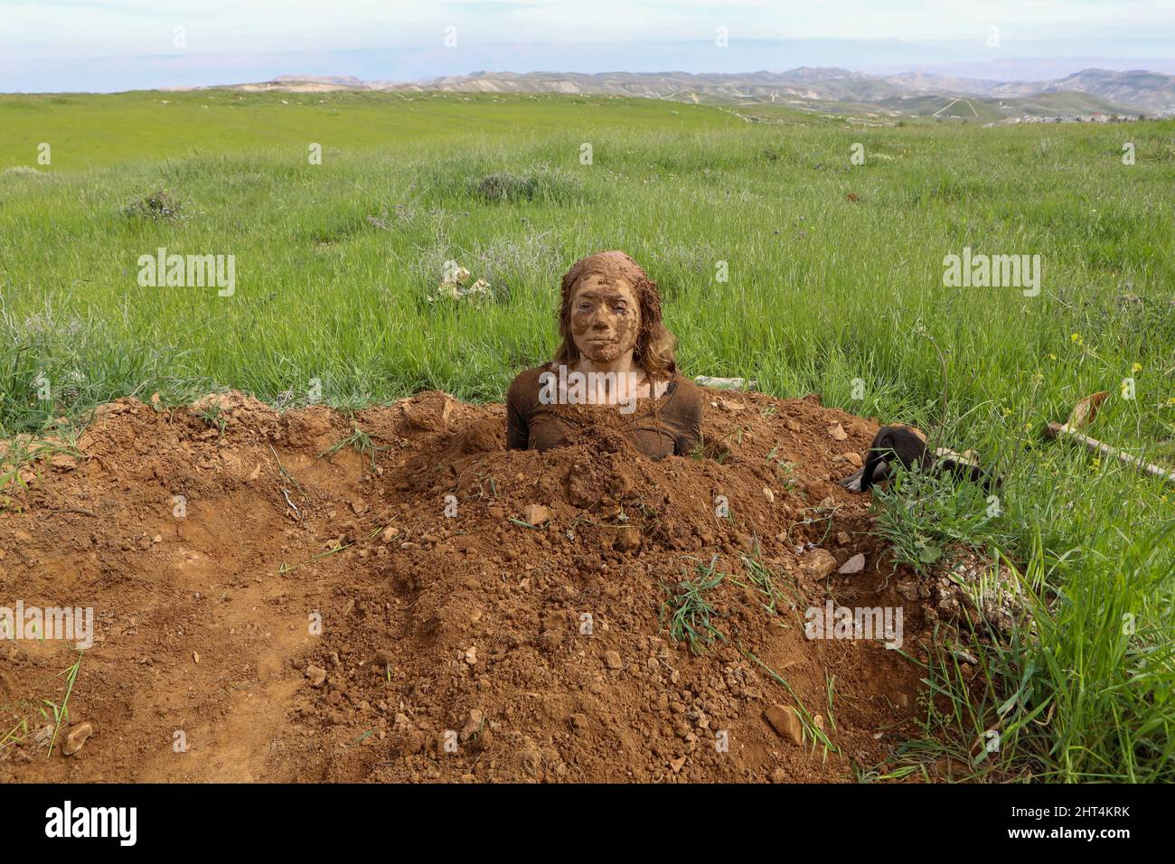 A woman buried in the ground A face covered in the ground Stock Photo ...