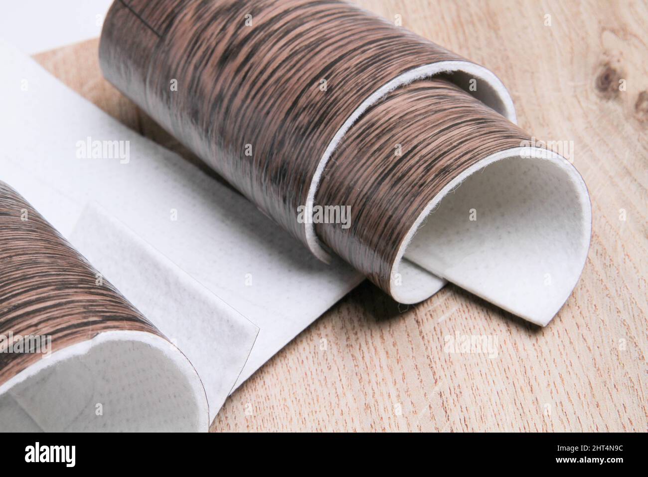 Linoleum. Roll of linoleum on a black background. Floor coverings ...