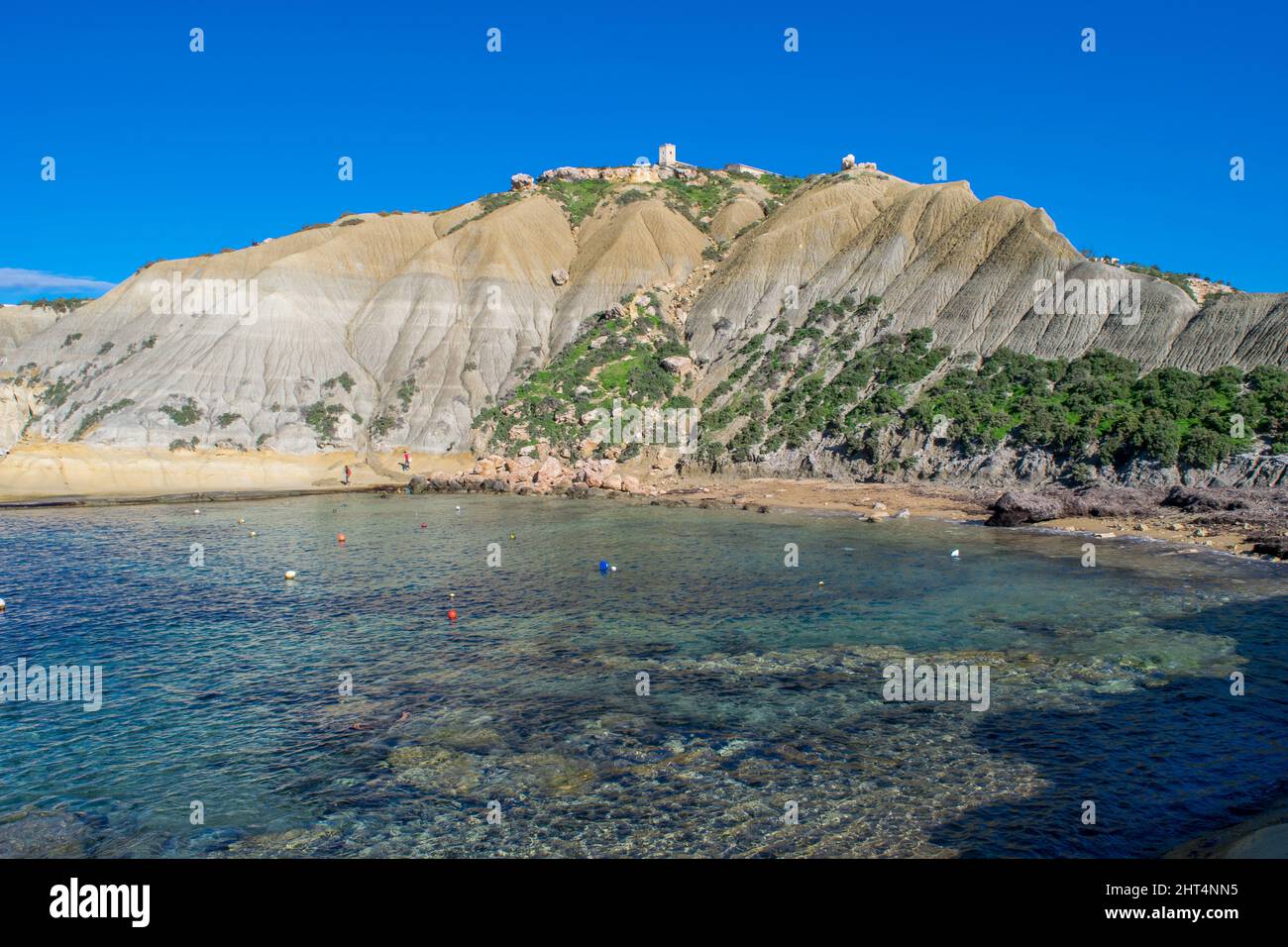 Steep blue clay slopes, with debris forming scree on coastline at Xatt ...