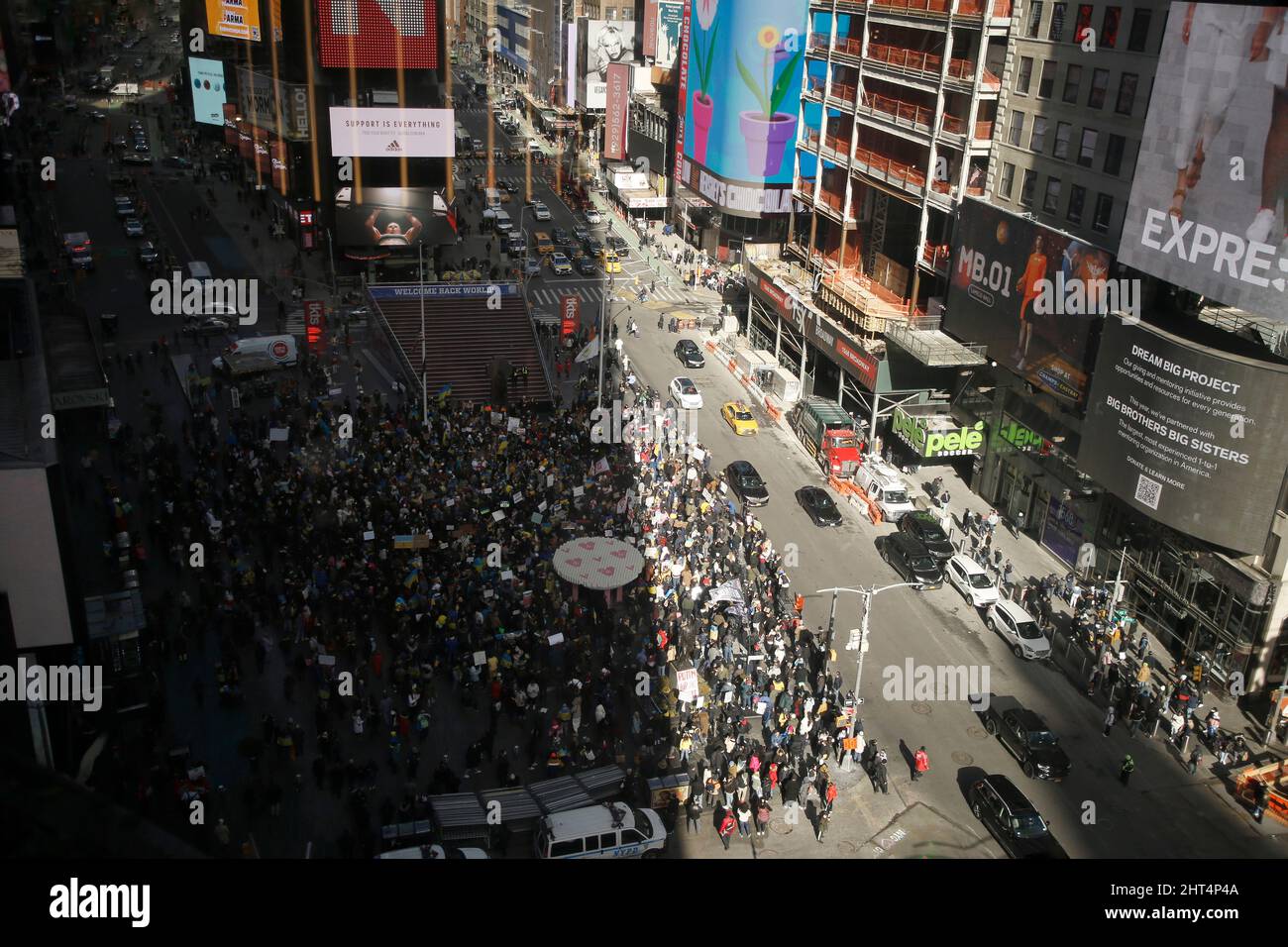 Ukraine supporters chant slogans with flags and signs during a rally in ...